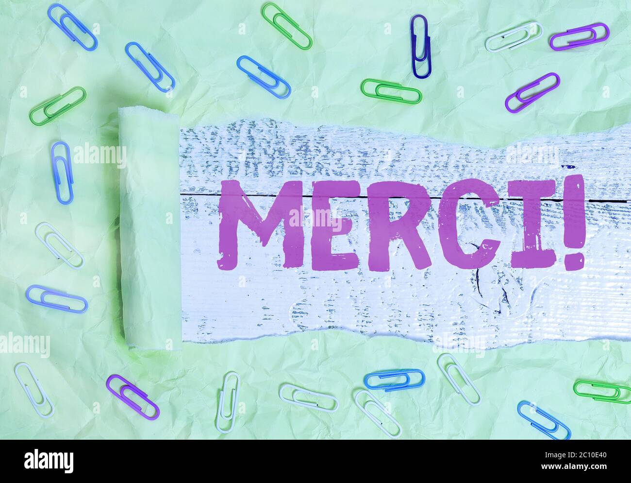 Writing note showing Merci. Business concept for thank you in French ...