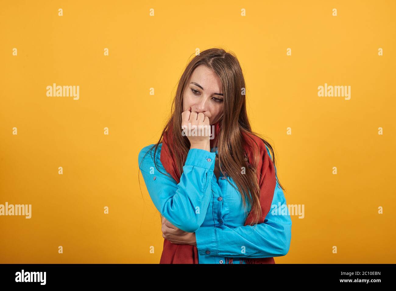 Scared, biting fist emotionally. Covering mouth behind knuckle. Having ...