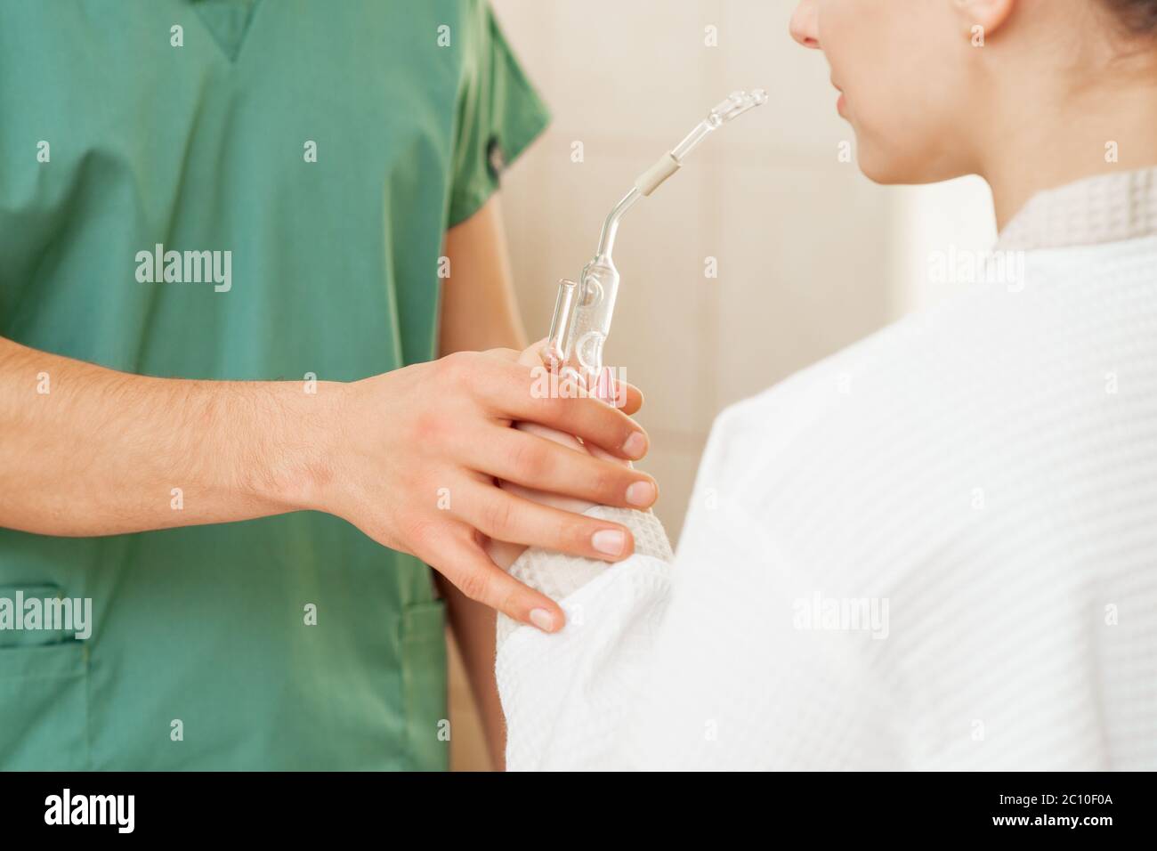 Woman receiving nasal inhalation in nose with essential oil in spa ...