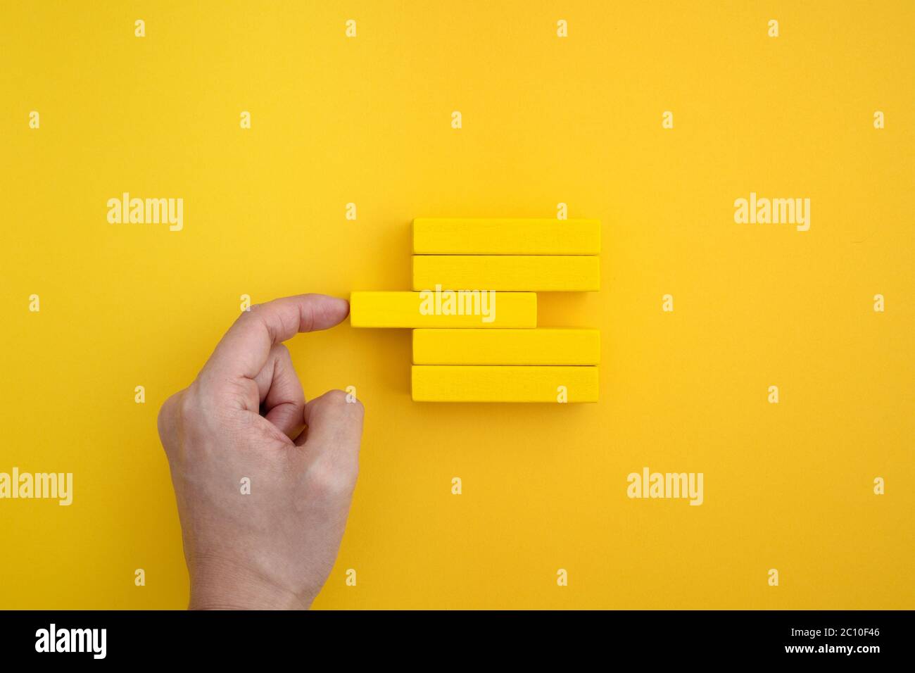fill a gap in the yellow block Stock Photo - Alamy