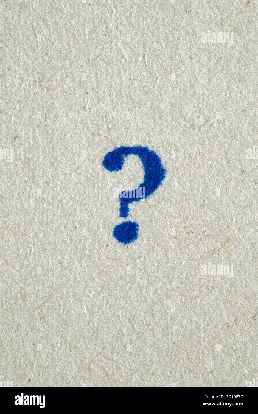 a question mark symbol stamped on a piece of paper Stock Photo - Alamy