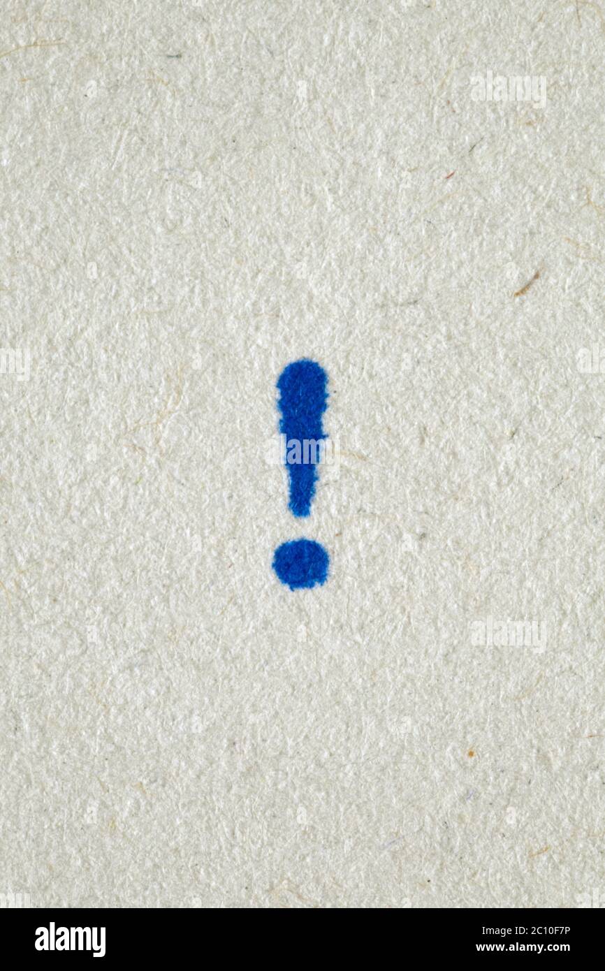 a exclamation mark symbol stamped on a piece of paper Stock Photo - Alamy