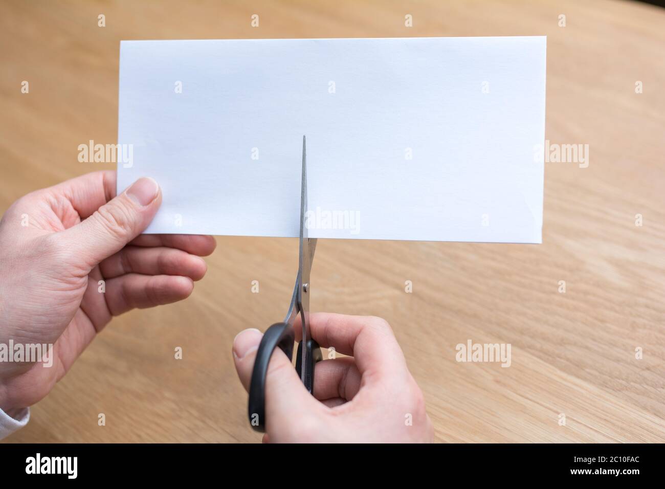 Scissors cutting paper people hi-res stock photography and images - Alamy