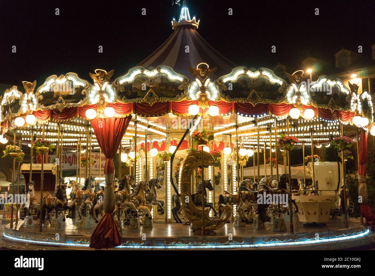 empty merry-go-round at night in carnival switzerland Stock Photo - Alamy