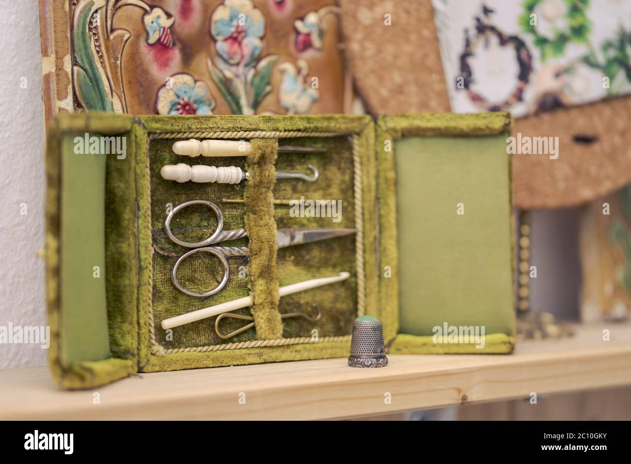 Antique rare sewing kit in open green velvet box with scissor, sewing ...