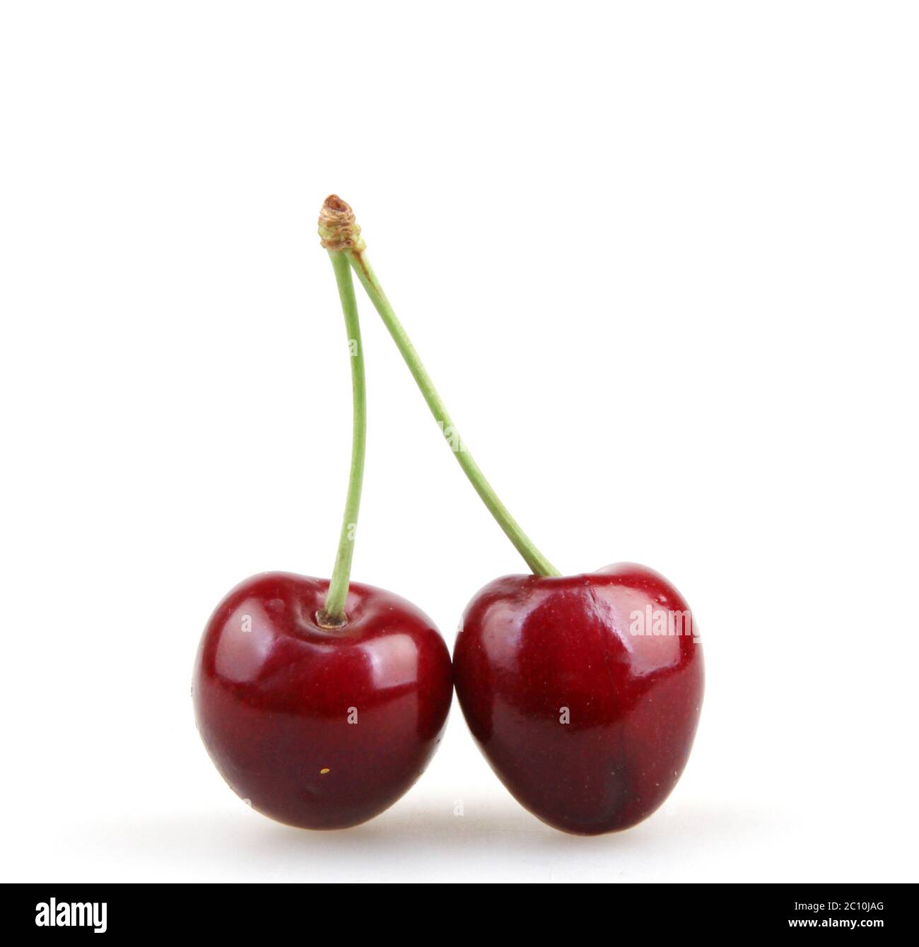 Sweet cherry isolated on white Stock Photo - Alamy