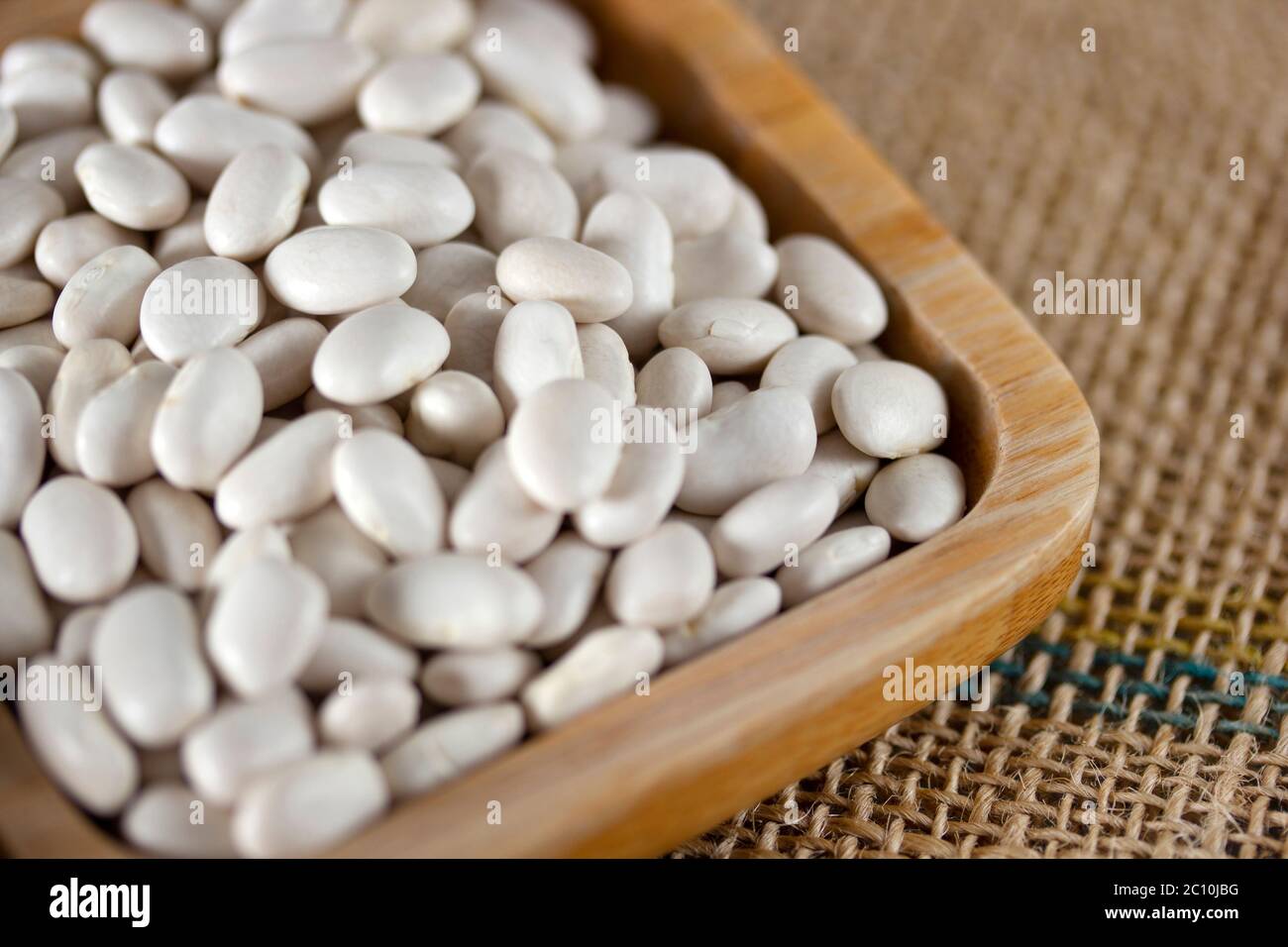 white beans in a wooden plate Stock Photo - Alamy