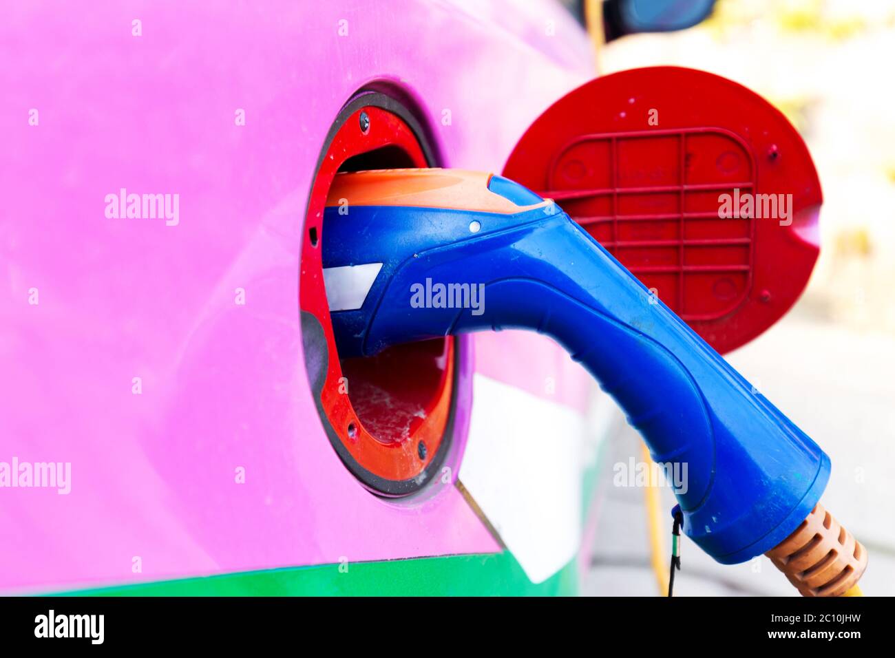 blue gas gun and pink car Stock Photo - Alamy
