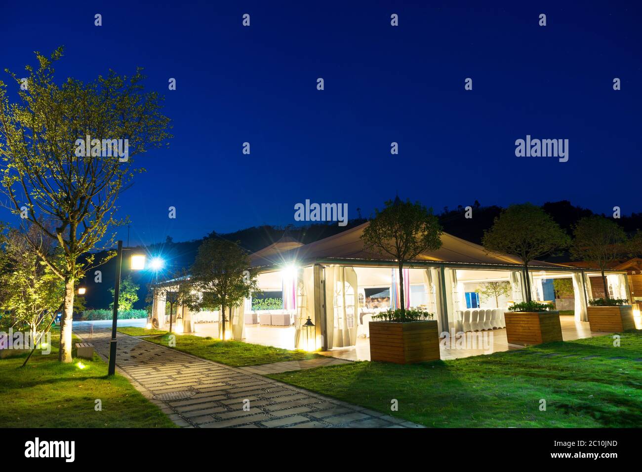 outdoor restaurant under huge tent at night Stock Photo - Alamy