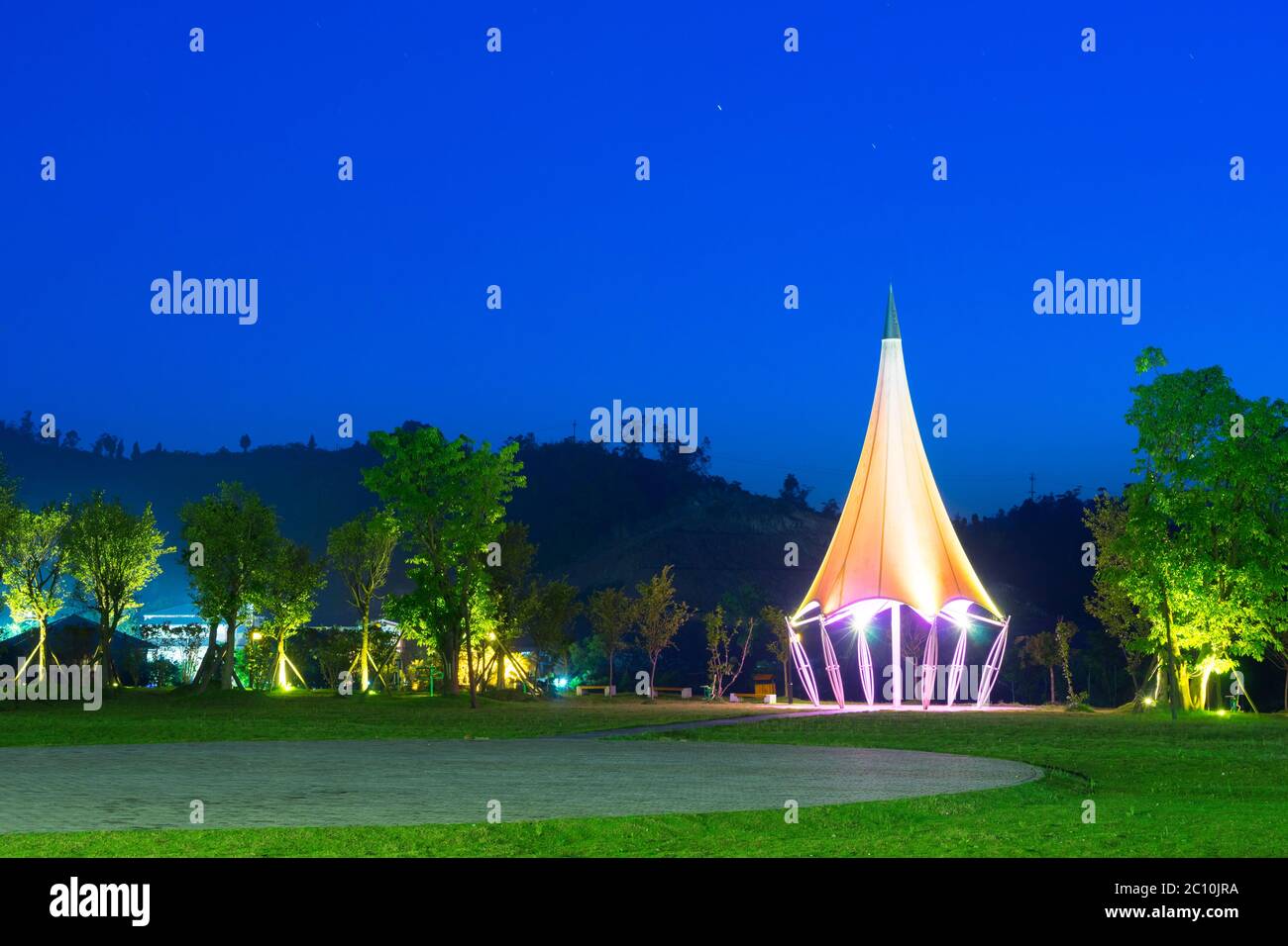small outdoor tent with sharp top in garden at night Stock Photo - Alamy