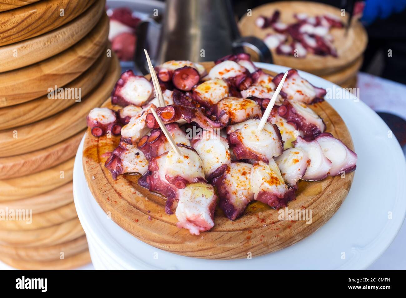 Octopus being prepared the Galician way ('á feira') at a stall in a ...