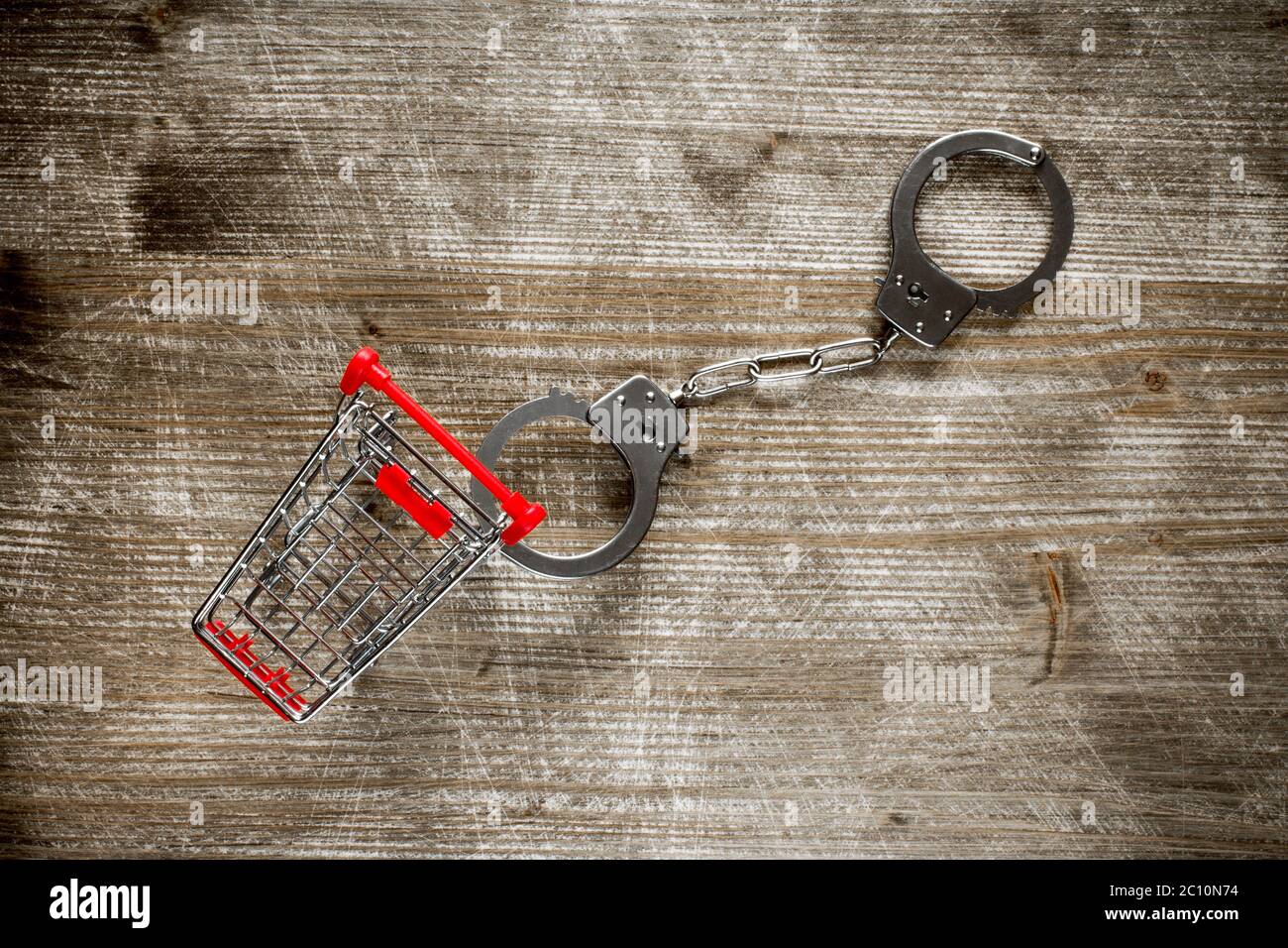 Shopping and handcuffs,top-view Stock Photo - Alamy