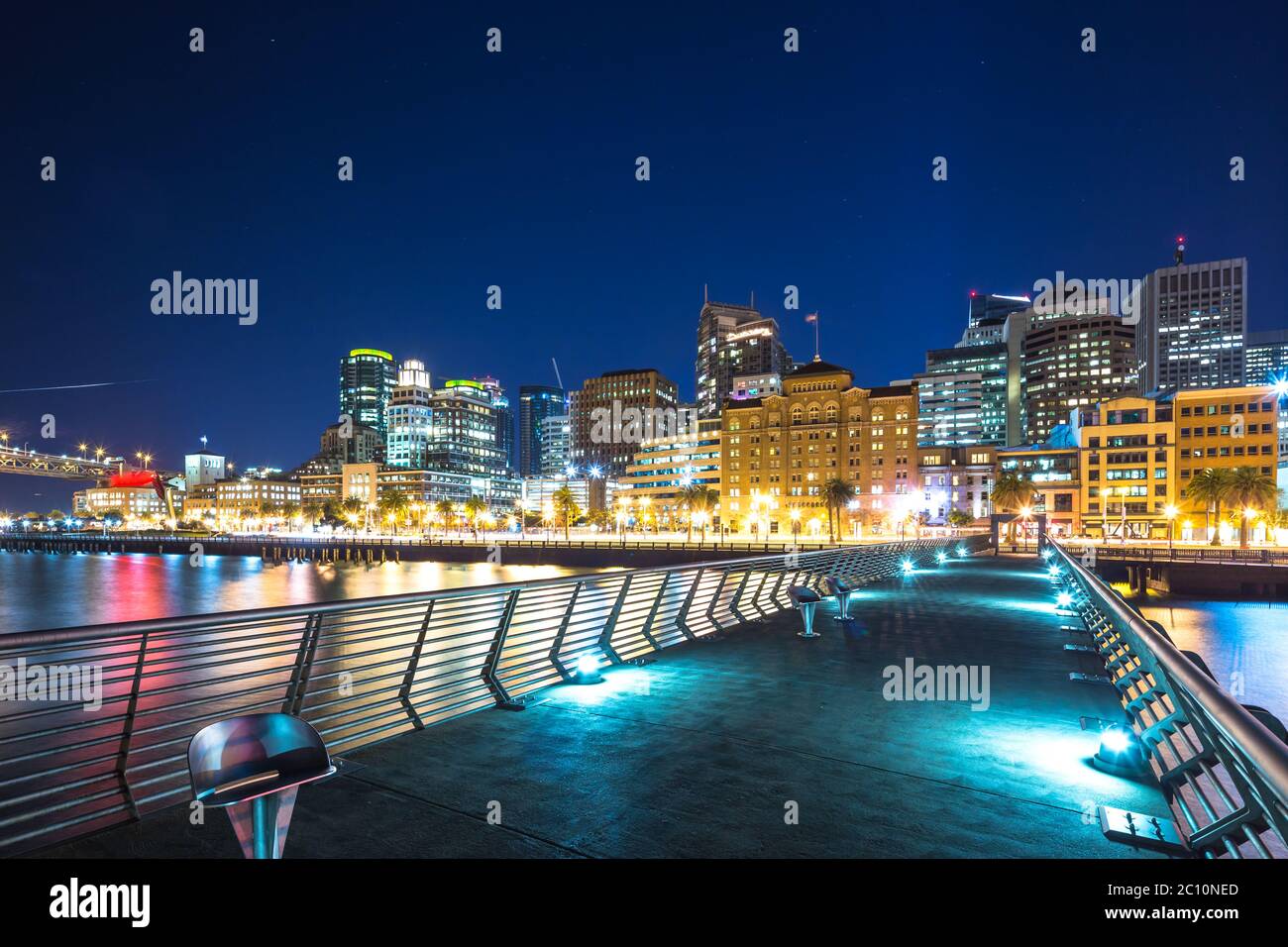 empty footpath over water to modern office buildings in san francisco ...