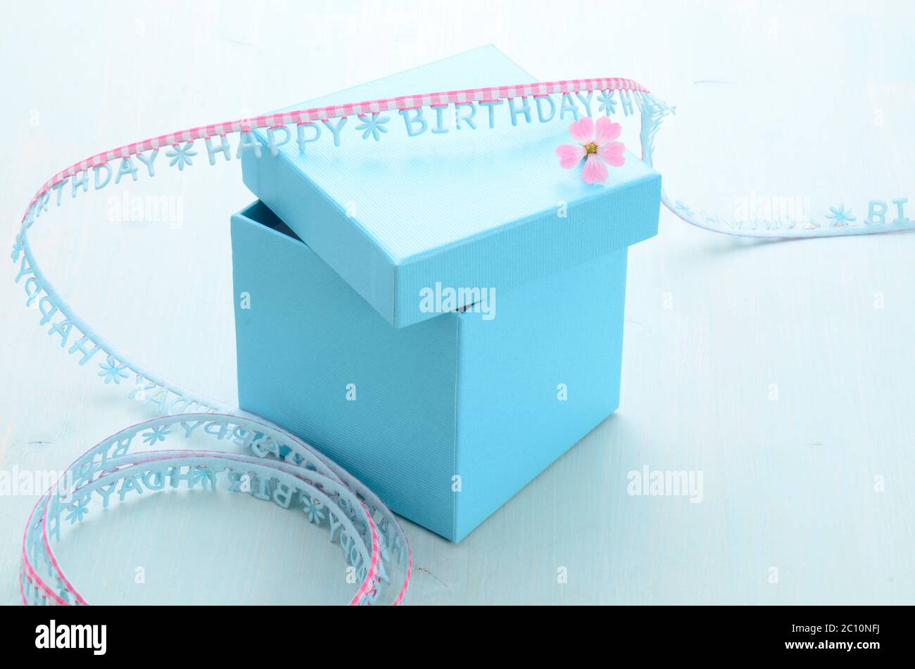 Little birthday present in a blue box Stock Photo - Alamy
