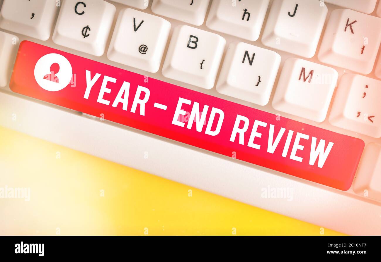 Writing note showing Year end Review. Business concept for annual ...
