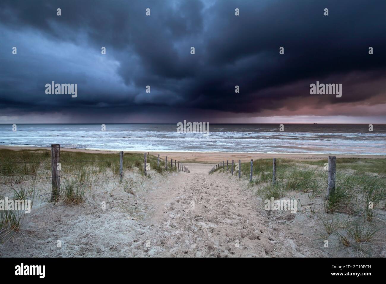 Dark clouds over sand hi-res stock photography and images - Alamy