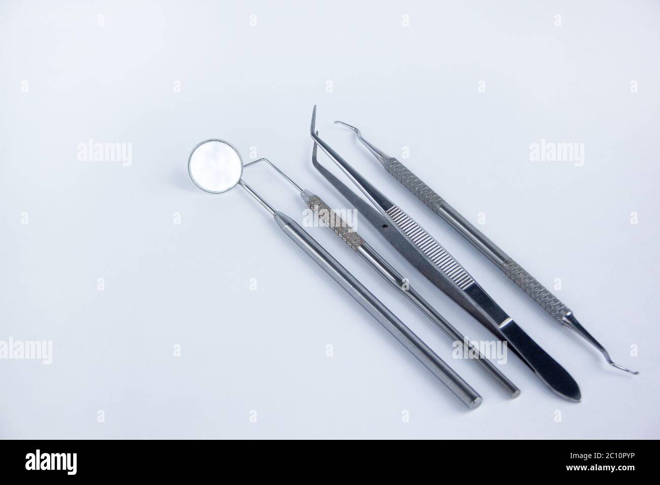 Group of dental tools for the treatment of teeth. Isolated on white ...