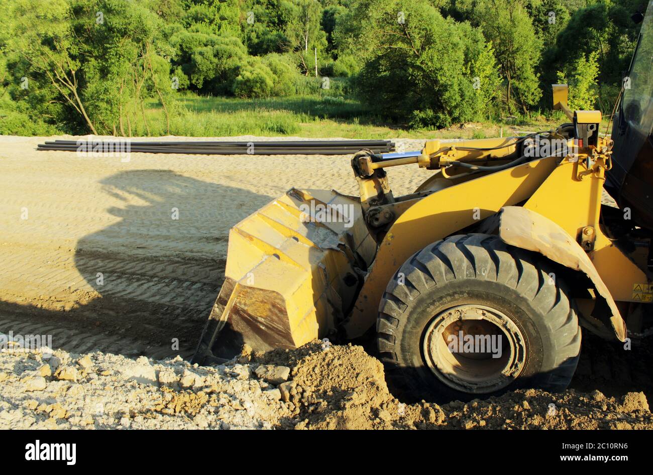 Wheel bulldozer machine for shoveling sand at eathmoving works in ...