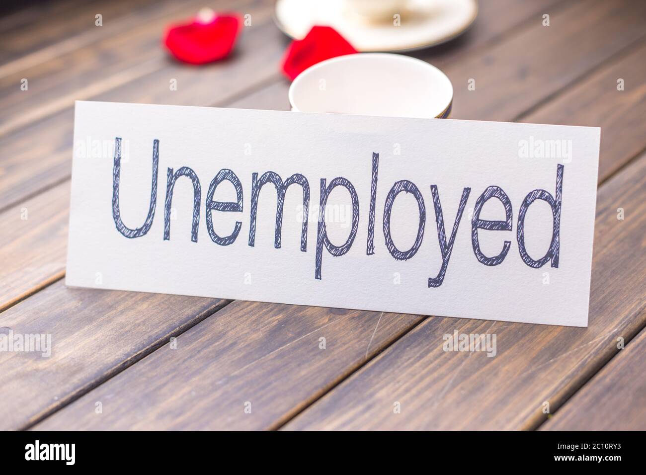 unemployed to employed on white paper Stock Photo - Alamy