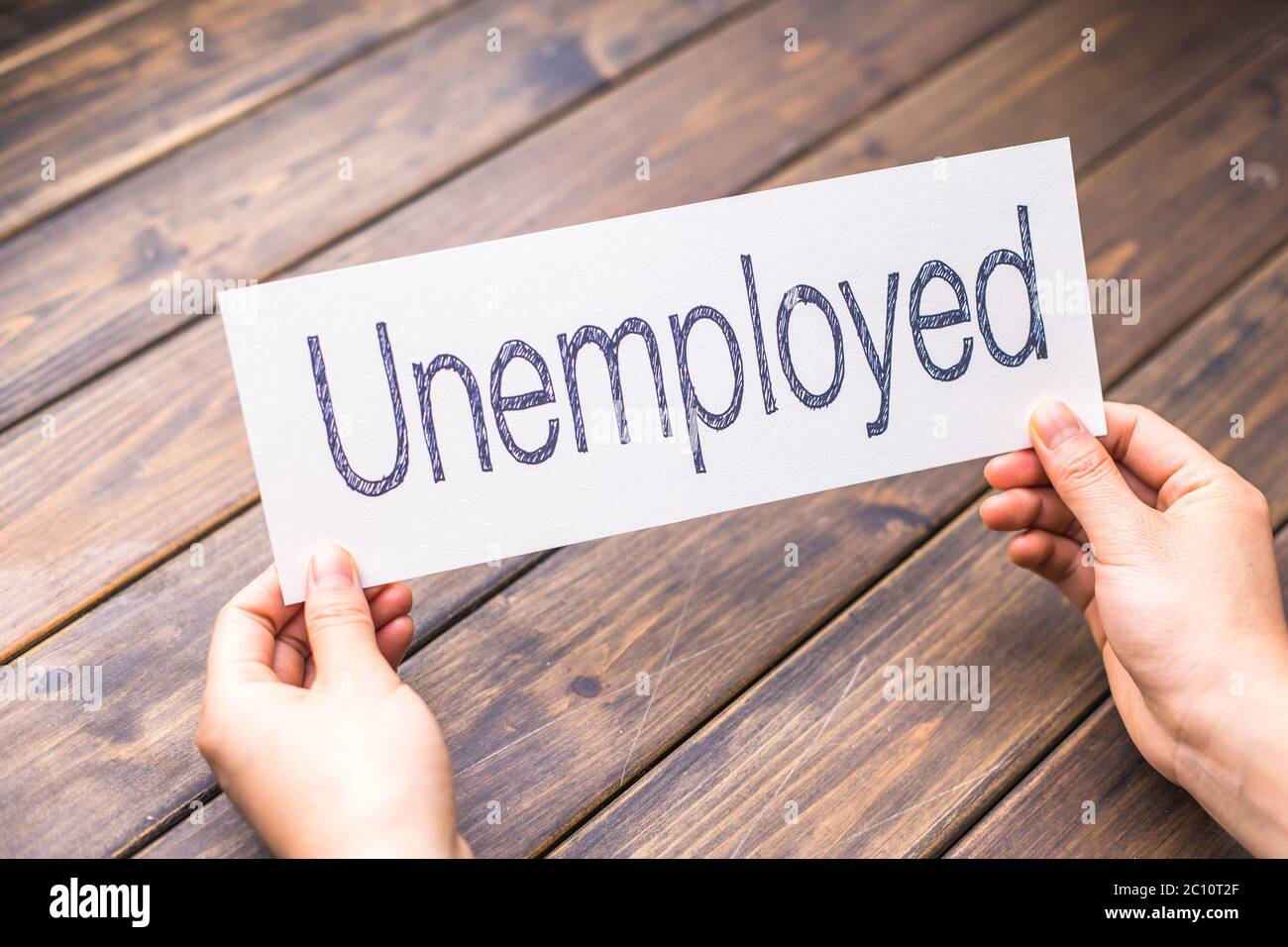 unemployed to employed on white paper Stock Photo - Alamy