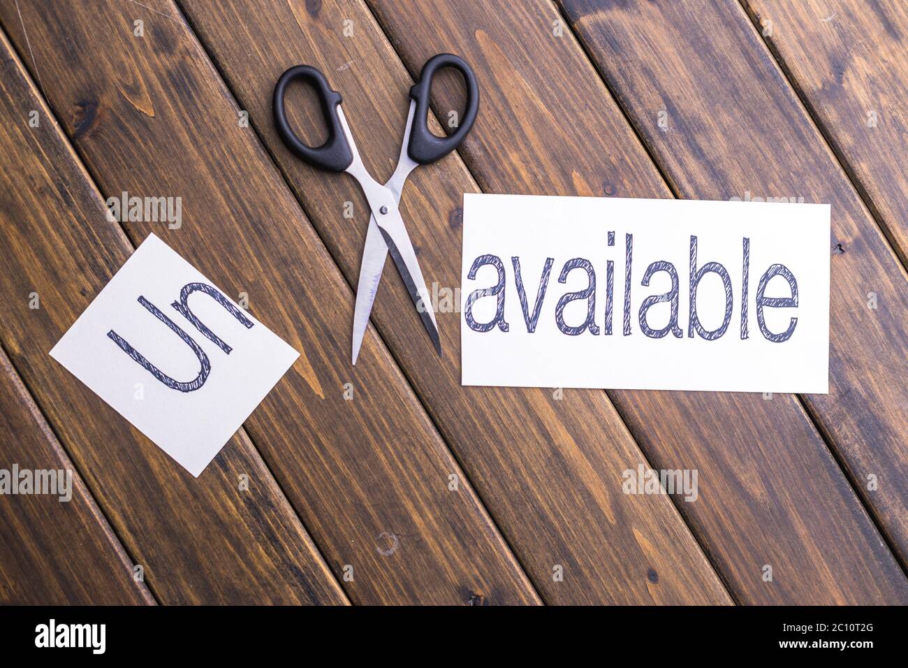 cut paper with word unavailable Stock Photo - Alamy