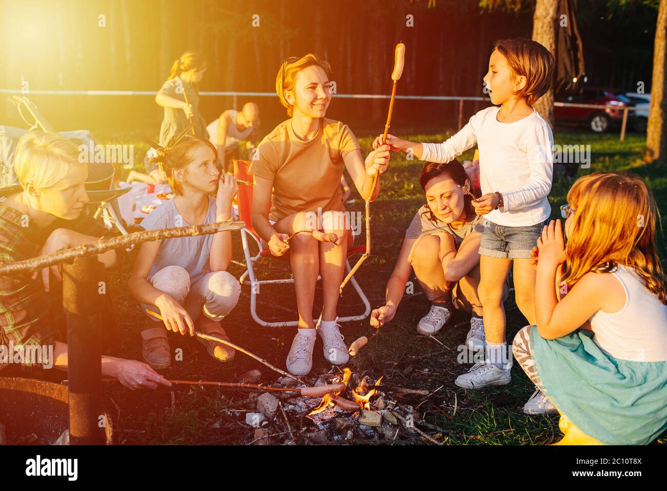 Group Friends Around Campfire High Resolution Stock Photography and ...