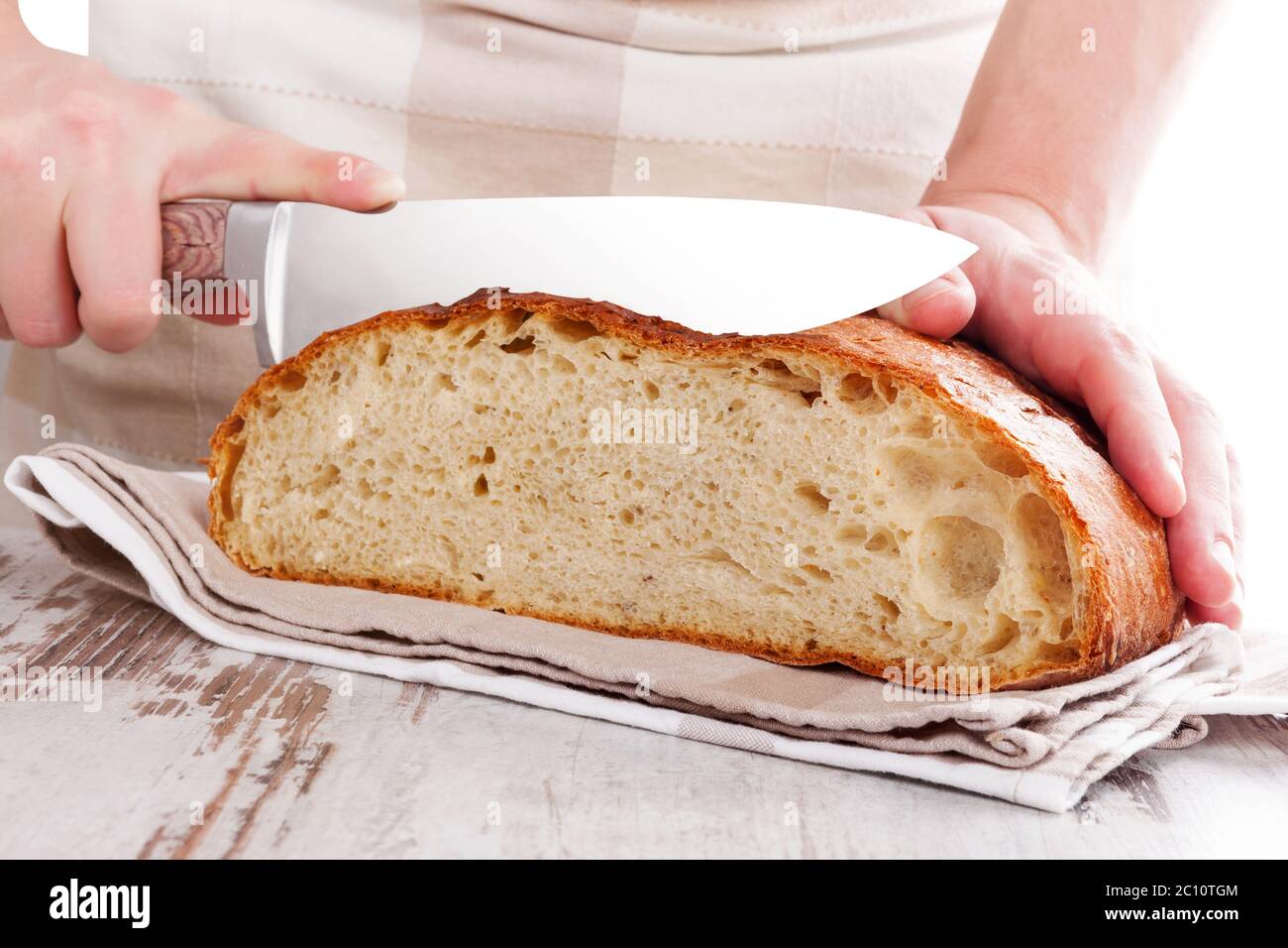 Baker cutting hi-res stock photography and images - Alamy