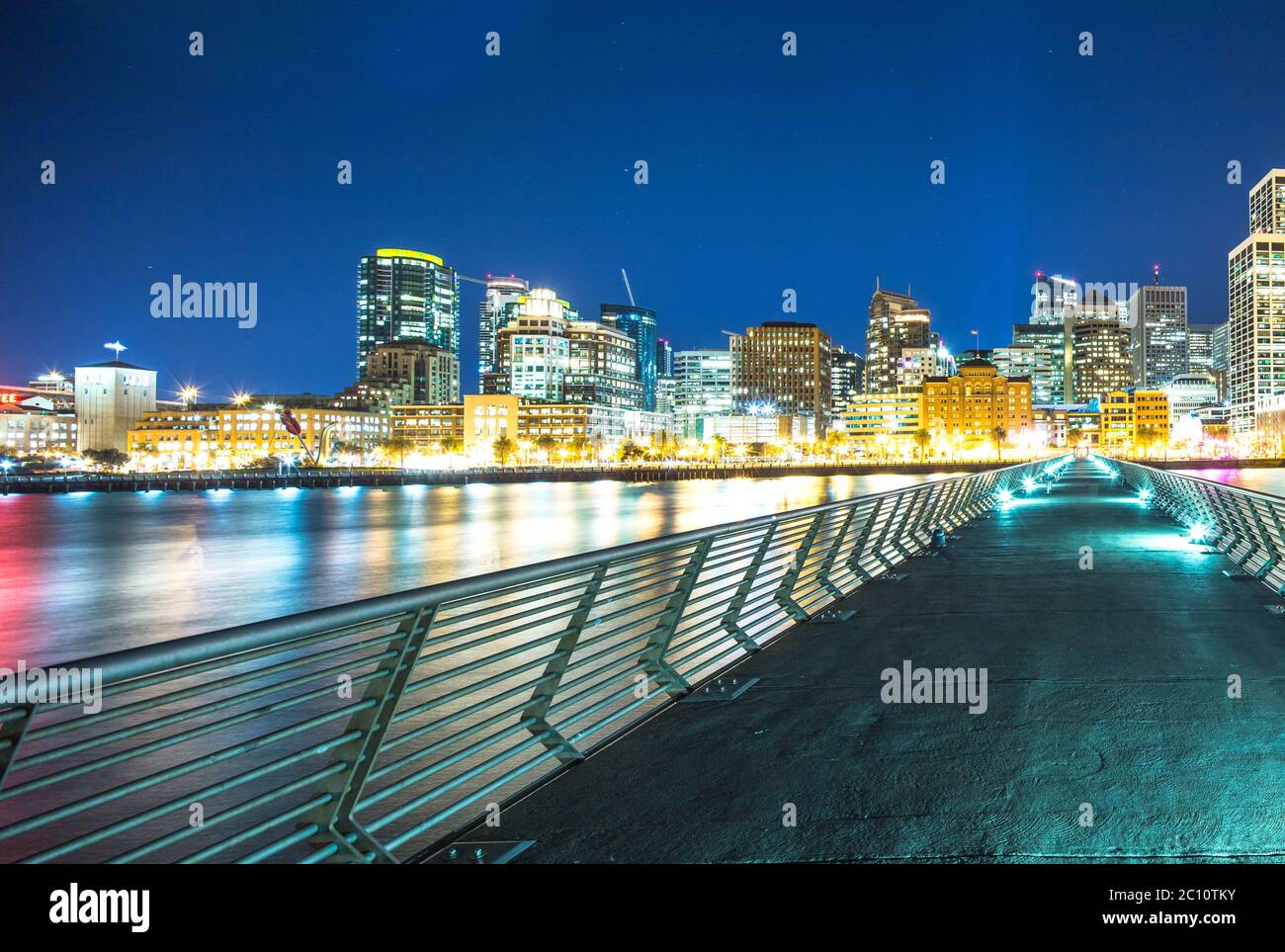empty footpath over water to modern office buildings in san francisco ...