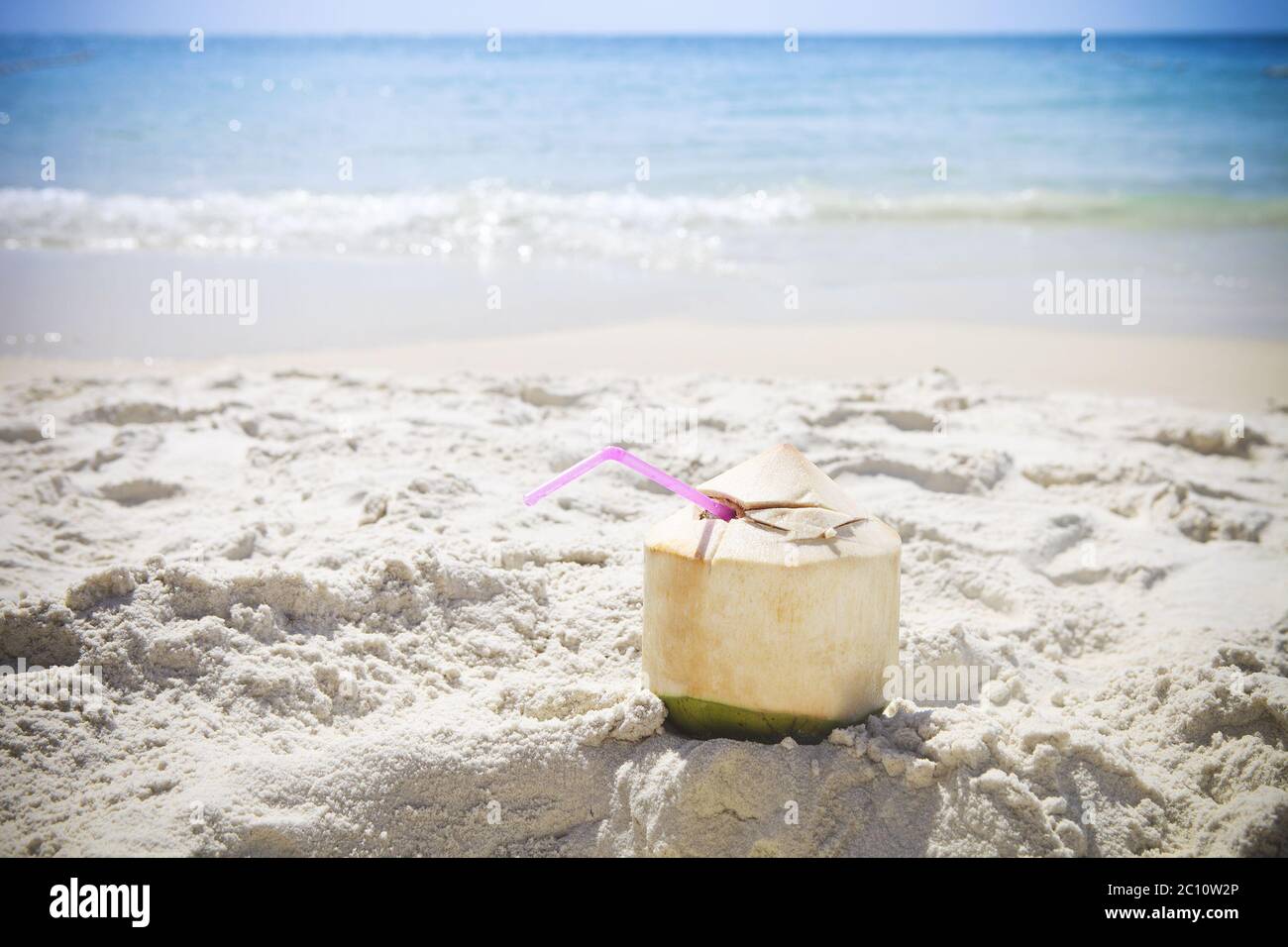 Fresh coconut cocktail on tropical beach Stock Photo - Alamy