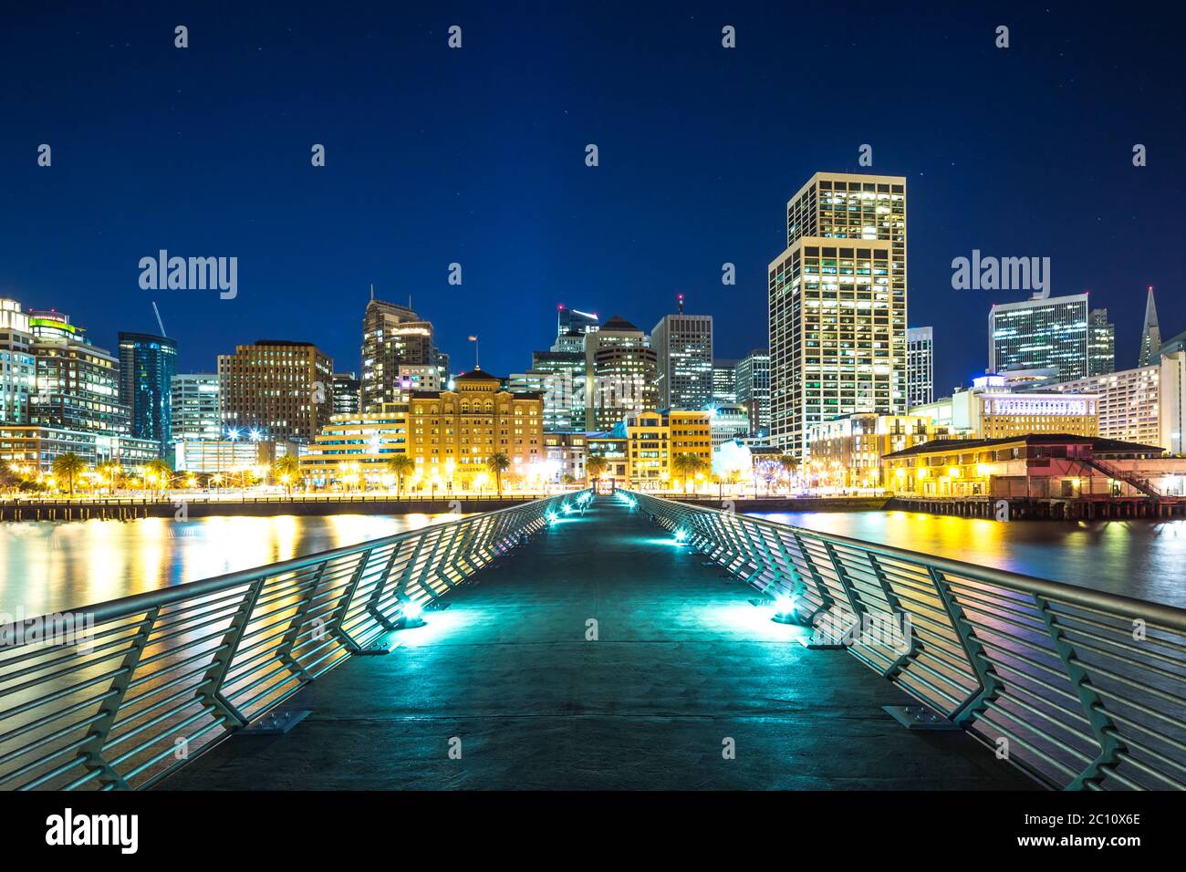 empty footpath over water to modern office buildings in san francisco ...