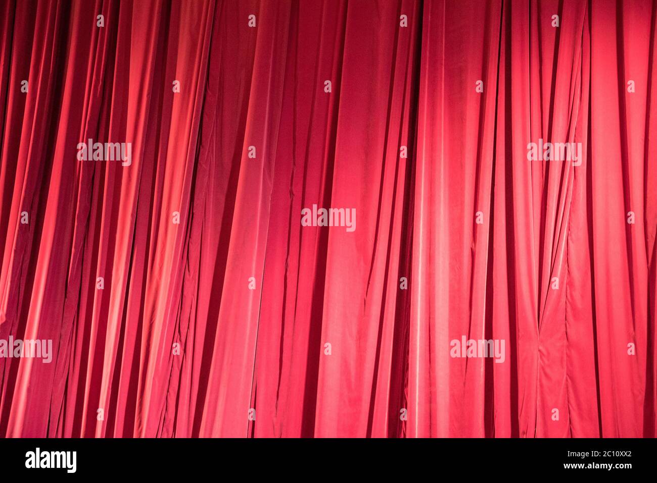 Beautiful red cloth of a theatrical curtain in close-ups as a ...