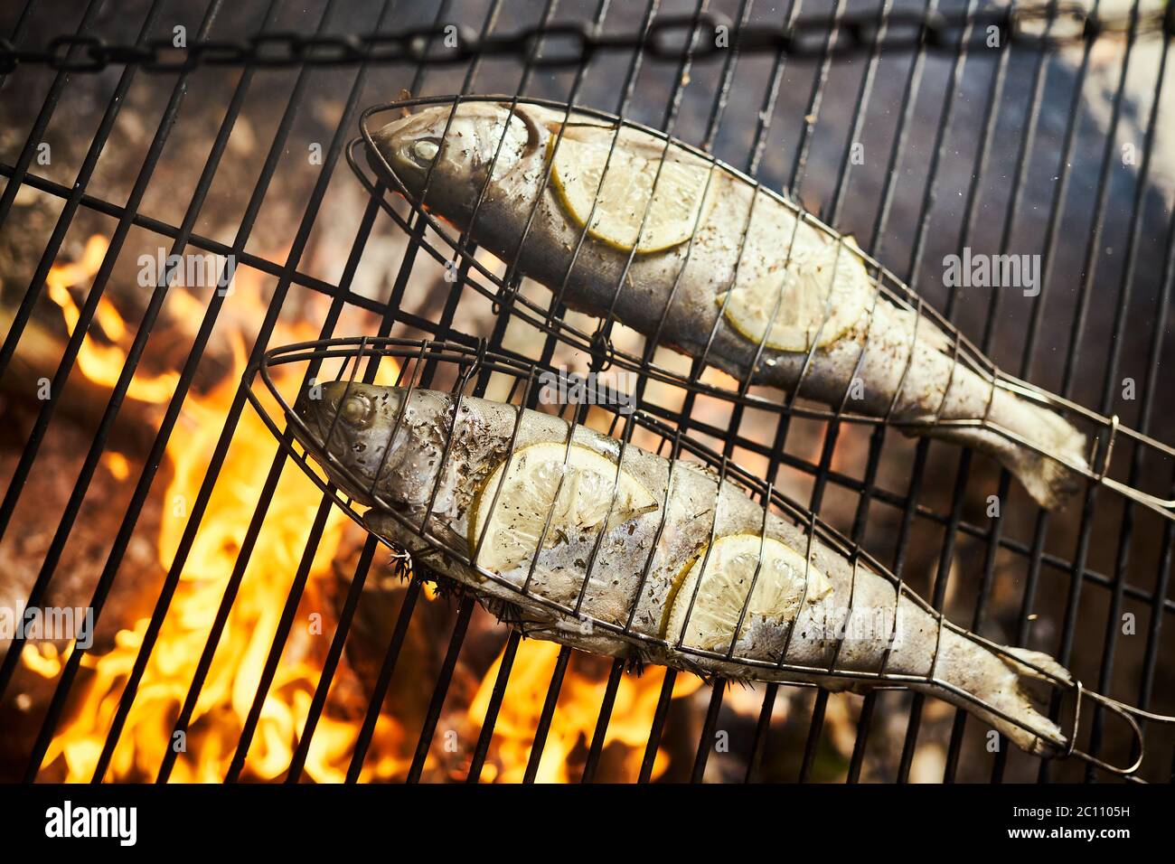 delicious trout with spices roast on a grill over a fire Stock Photo ...
