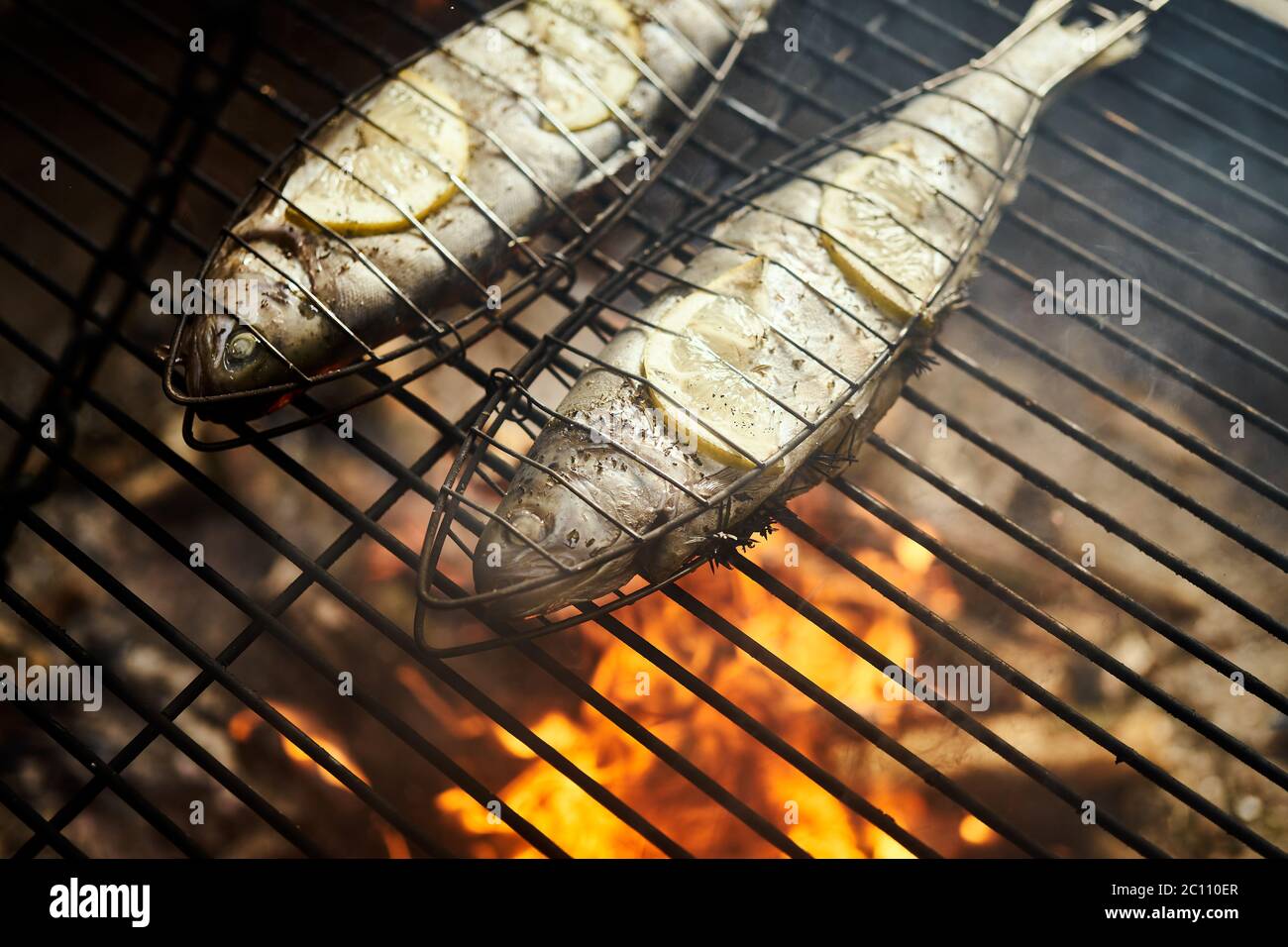 delicious trout with spices roast on a grill over a fire Stock Photo ...