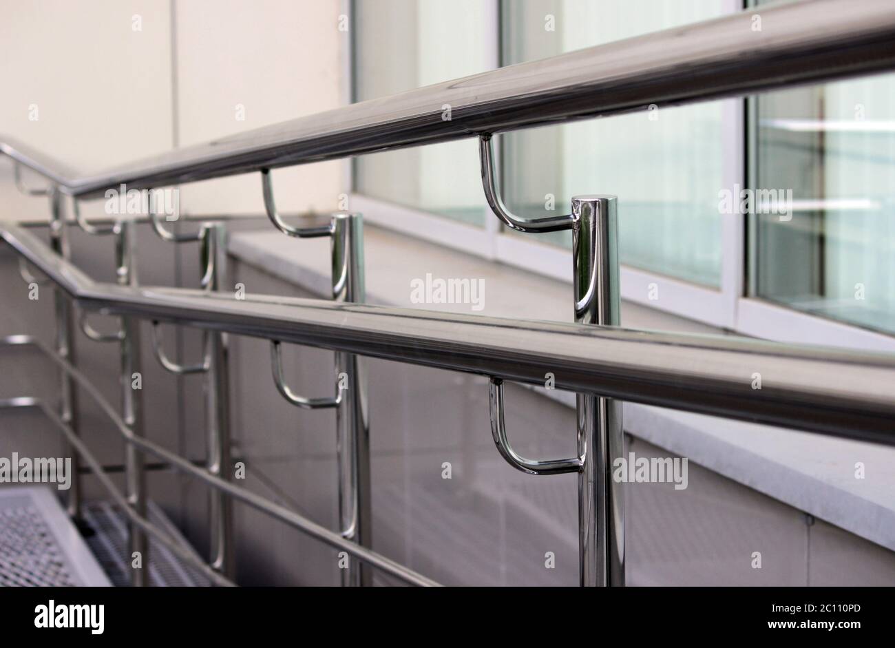 double handrails made of stainless steel in the street Stock Photo - Alamy
