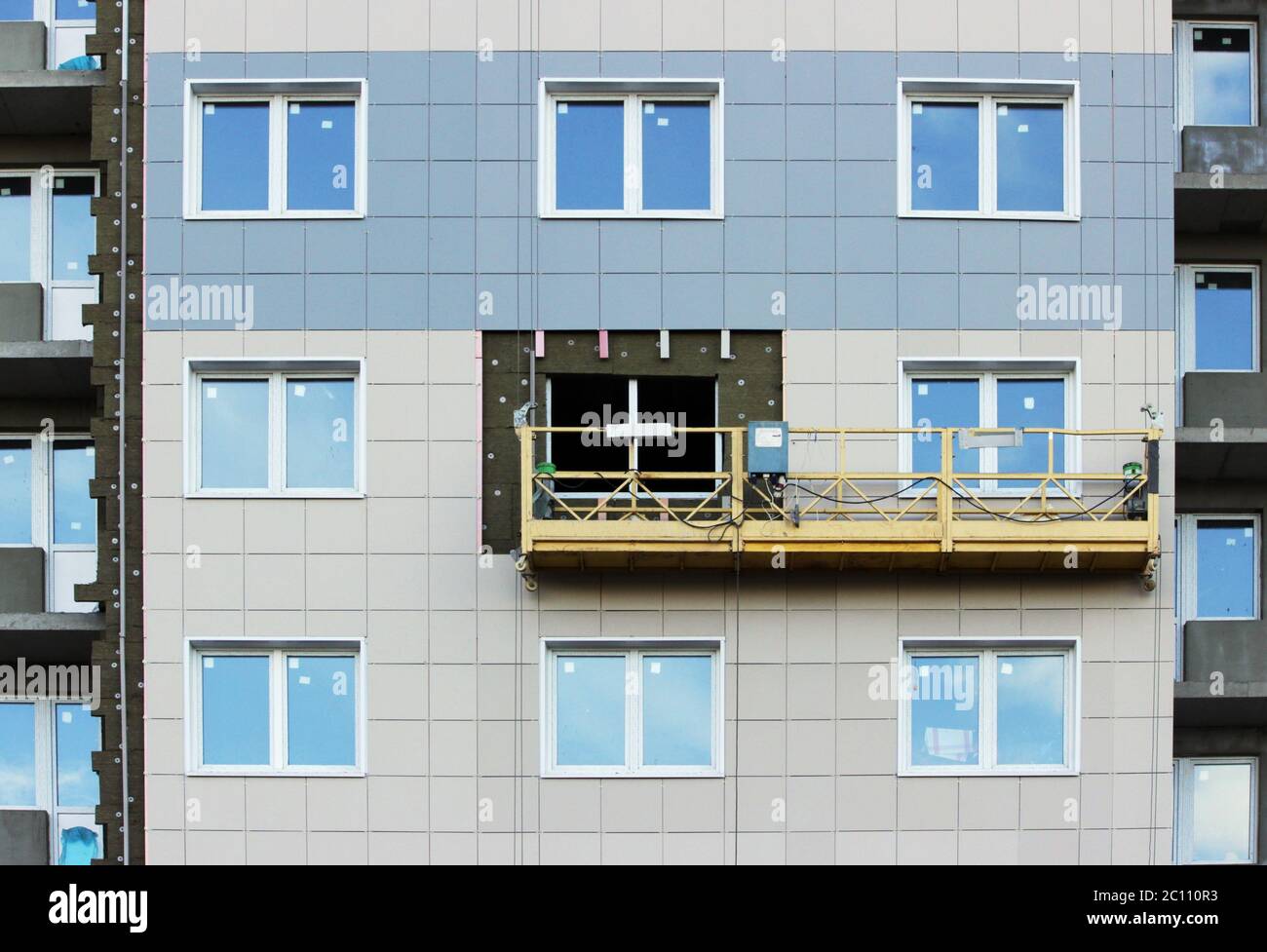 construction suspended cradle without workers on a newly built high ...