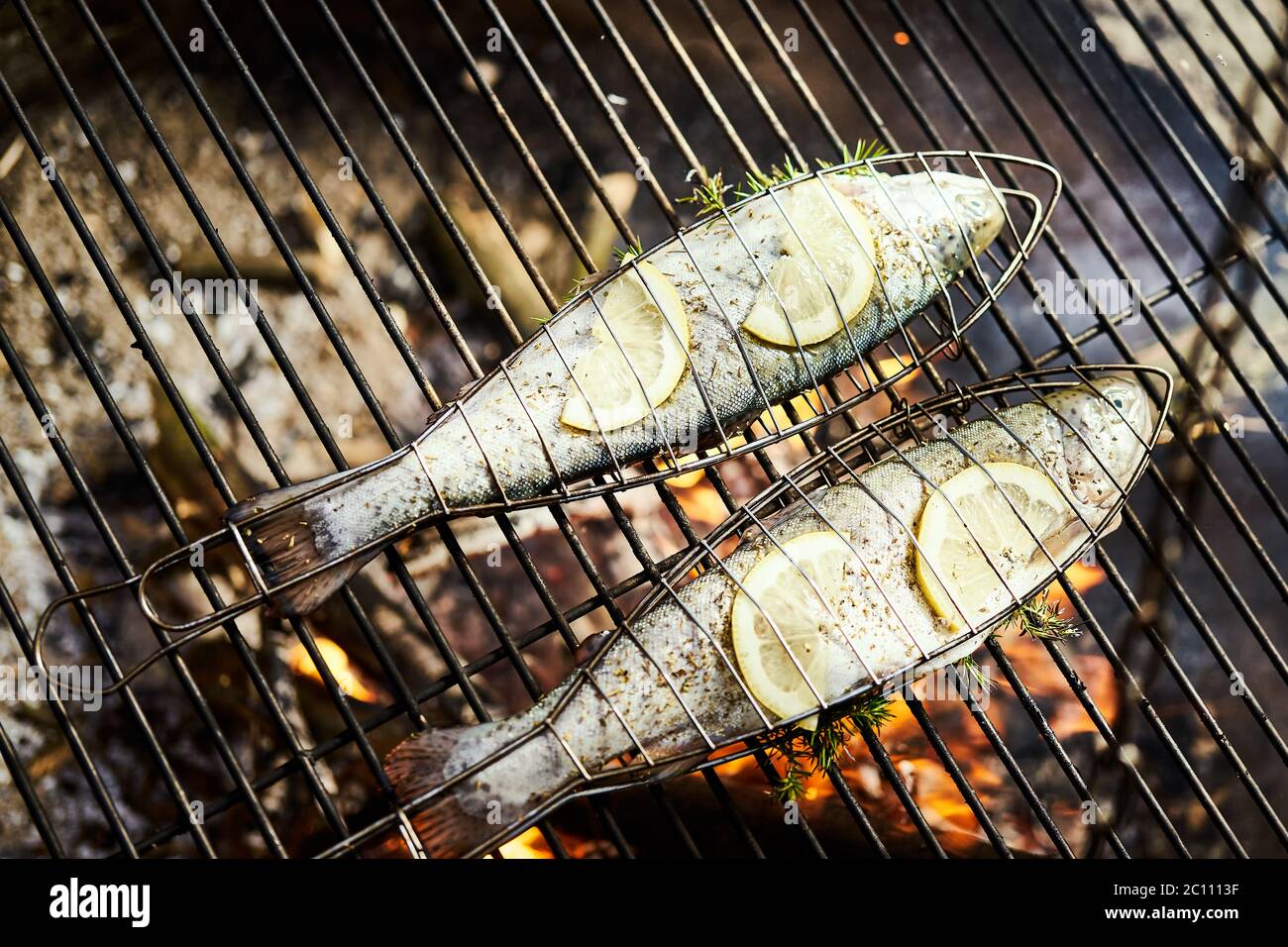 delicious trout with spices roast on a grill over a fire Stock Photo ...
