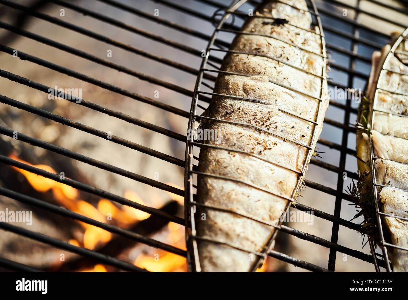 delicious trout with spices roast on a grill over a fire Stock Photo ...