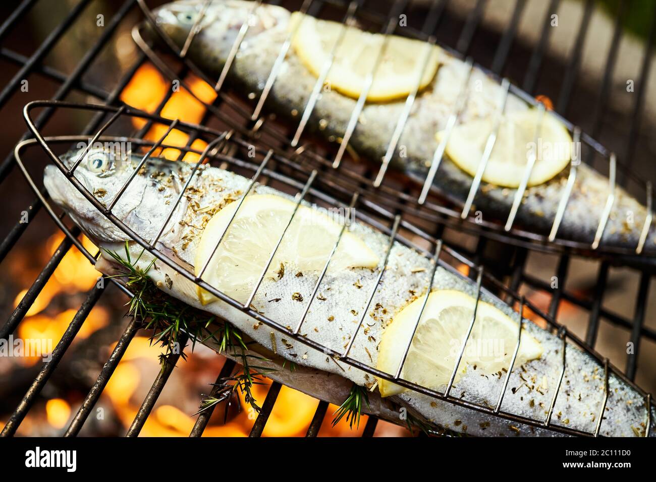 delicious trout with spices roast on a grill over a fire Stock Photo ...