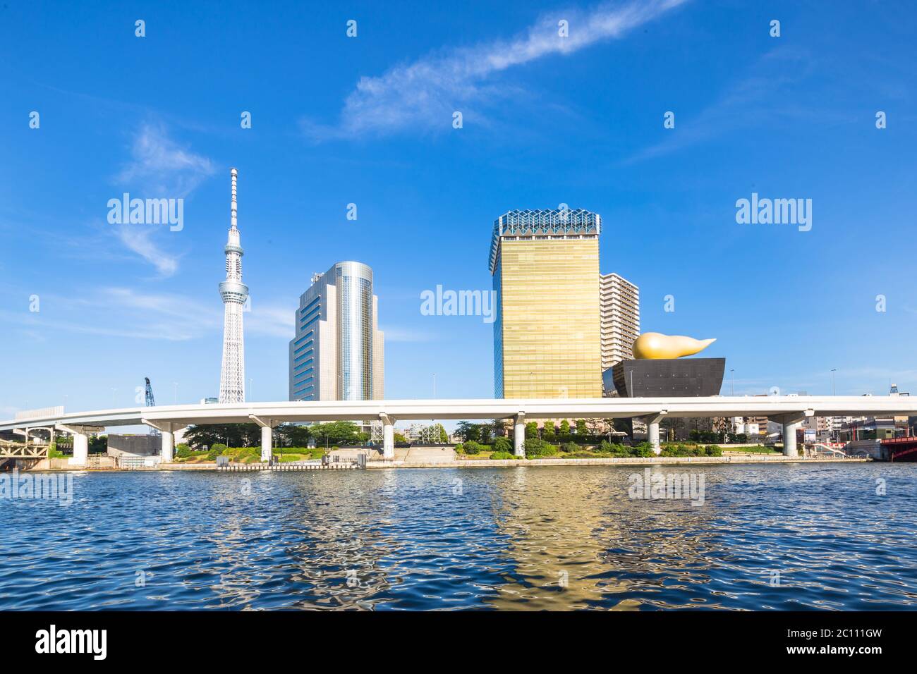 bridge,water,modern buildings and tokyo tower in blue sky Stock Photo ...