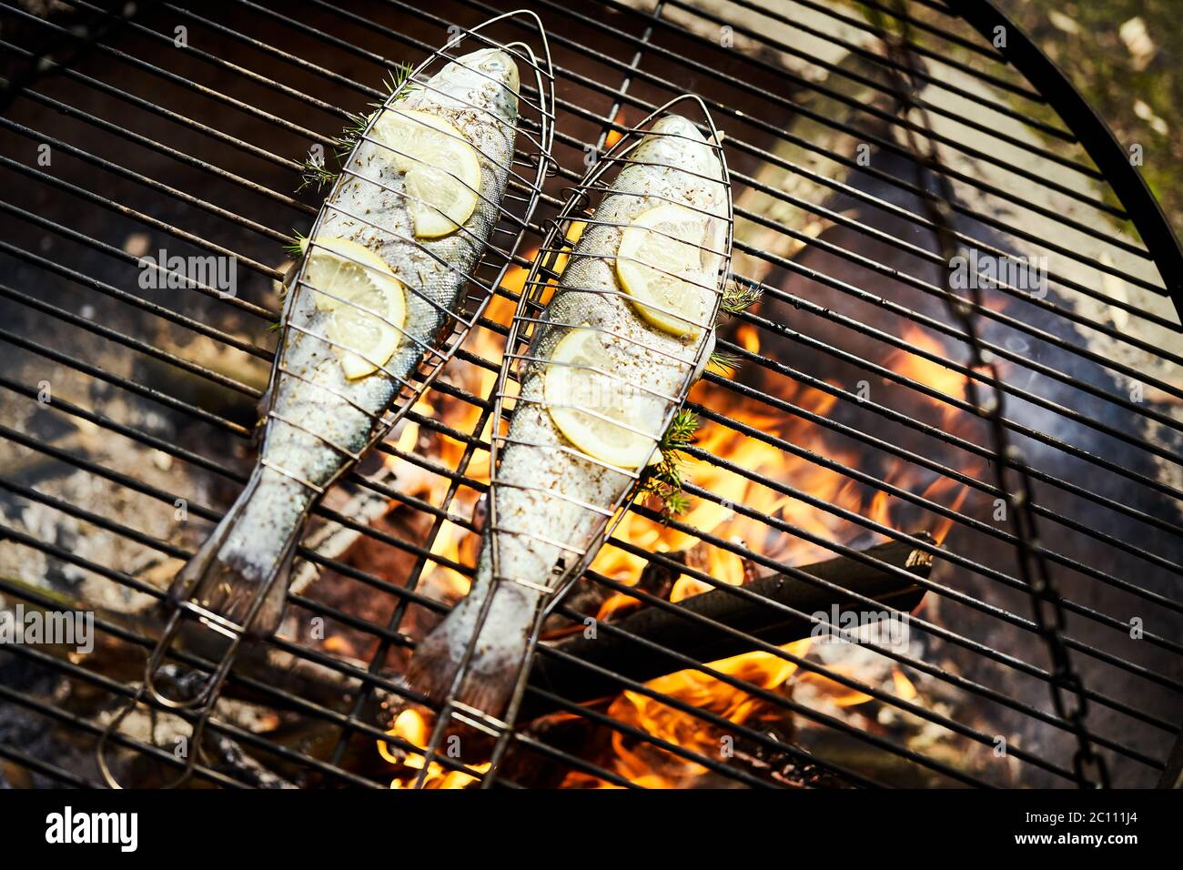 delicious trout with spices roast on a grill over a fire Stock Photo ...