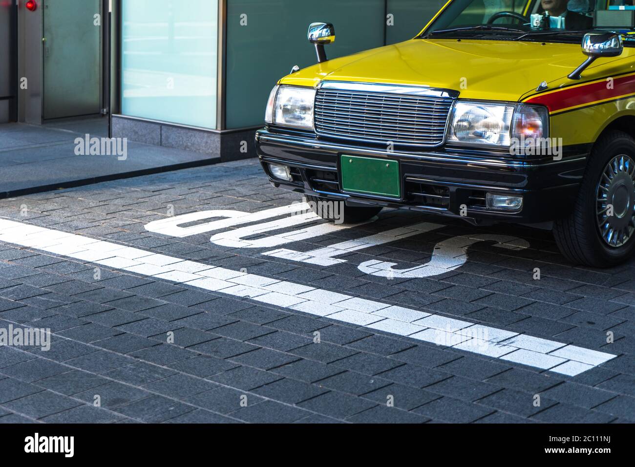 yellow car in stop line Stock Photo - Alamy