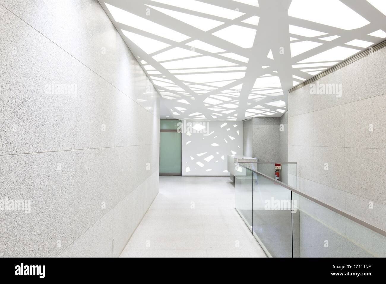 empty corridor with glass railing and abstract ceiling Stock Photo - Alamy