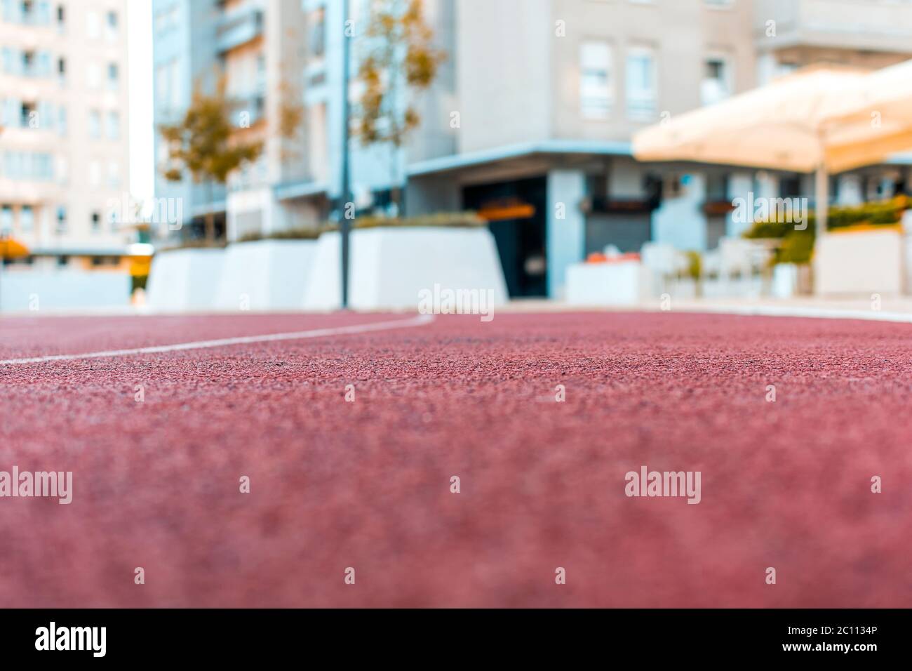 Red running track sports texture surface with fild blur Stock Photo - Alamy