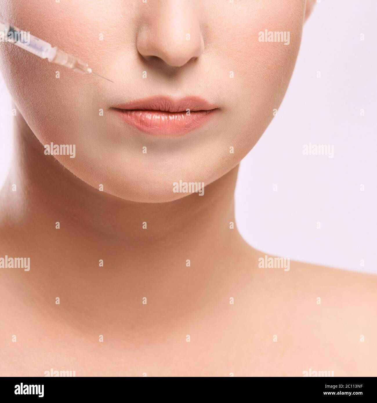 Face needle injection. Young woman cosmetology procedure. Doctor gloves ...