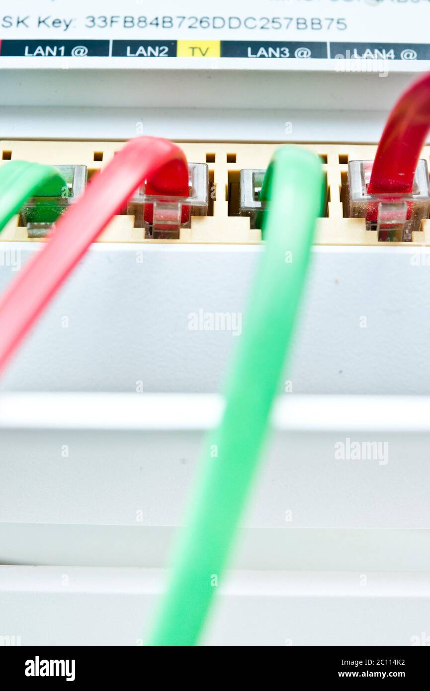 sockets and cables on the back of a broadband Ethernet router Stock ...