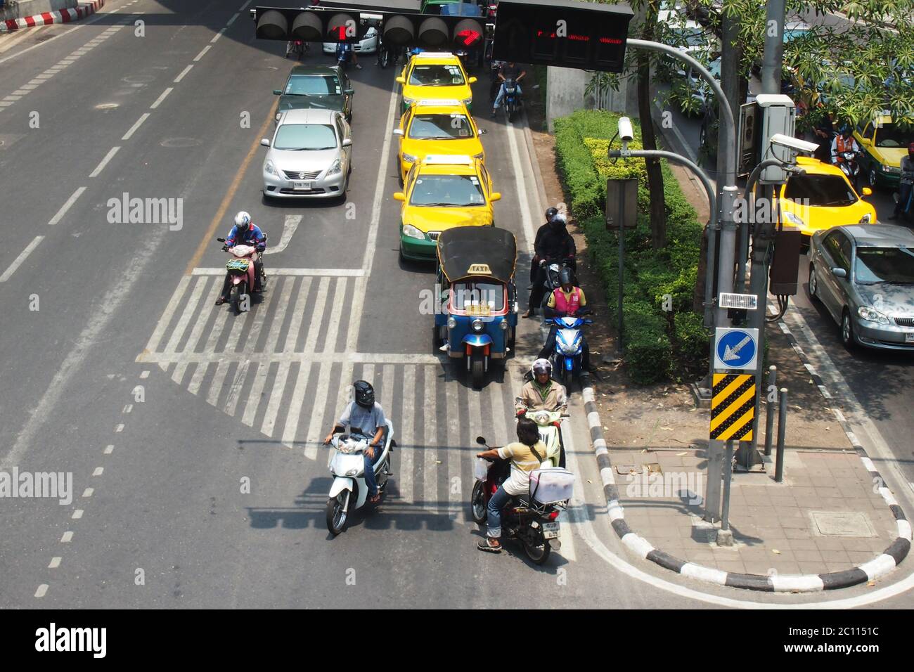 A motorbike reckless against the direction at a traffic light Stock ...