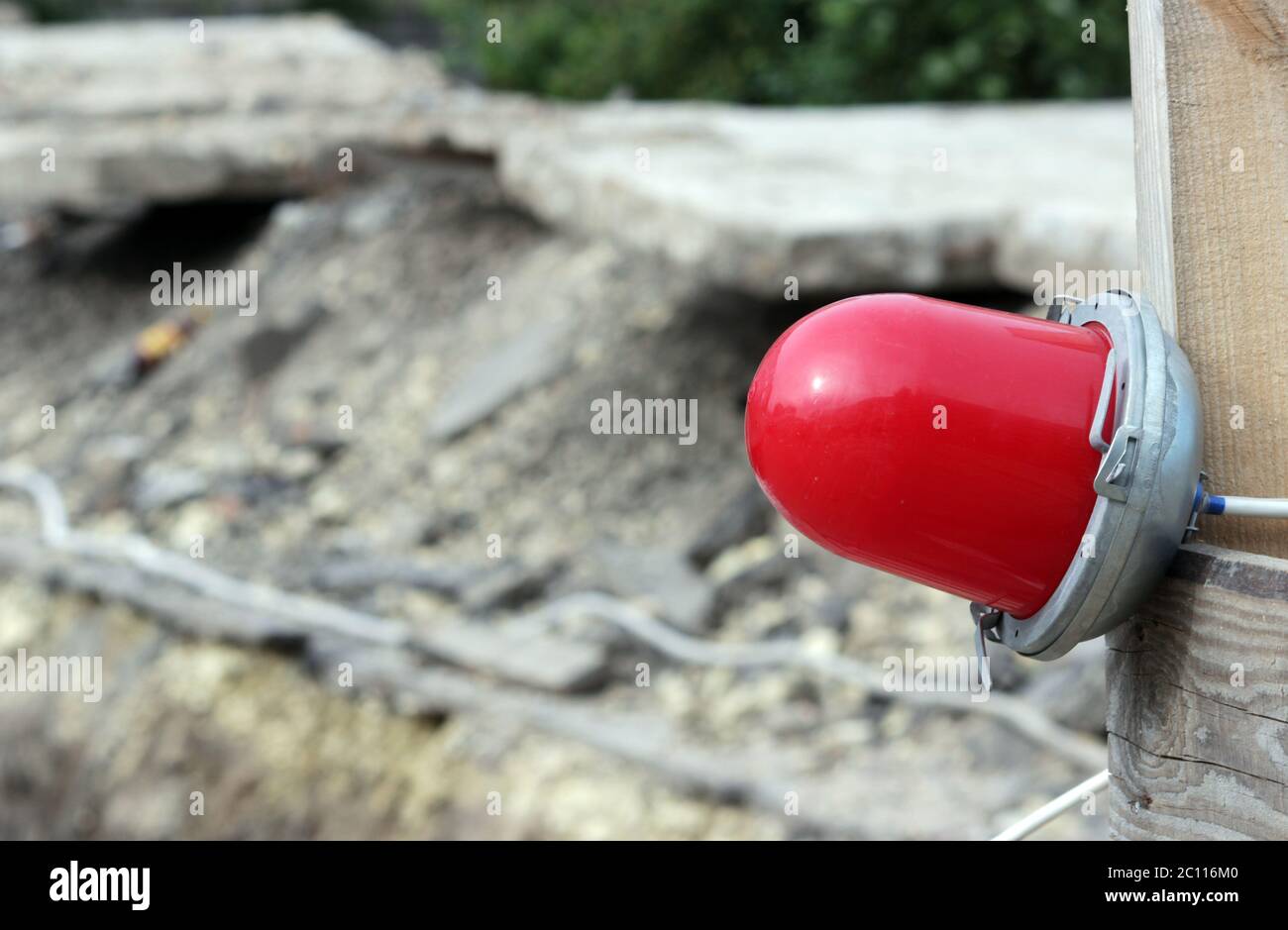 Red warning light which enclosing the ditch, where the repair of water ...