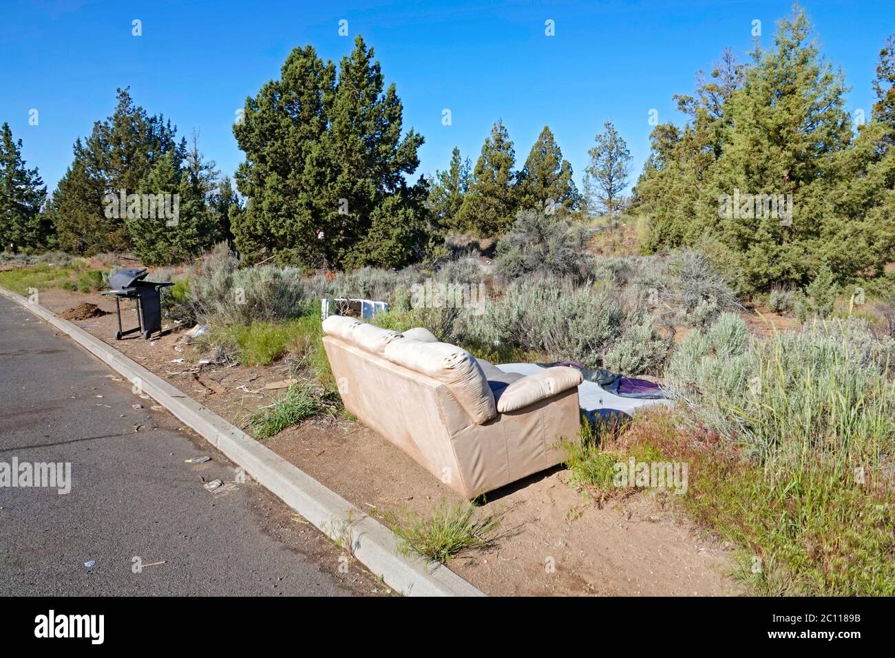 Piles of garbage and rubbish left by homeless people line a street in ...