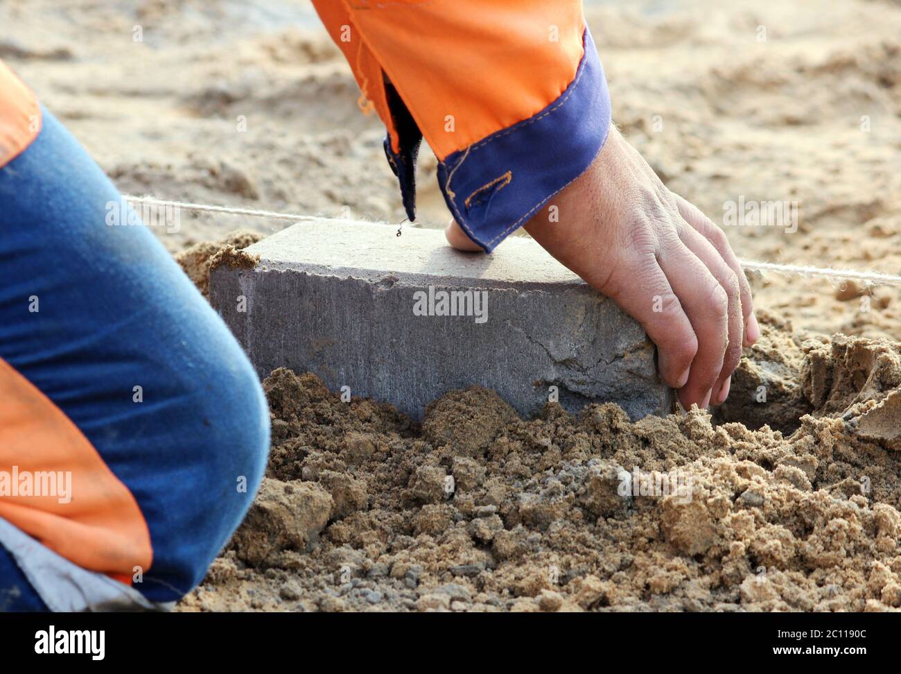 Laying sidewalk hi-res stock photography and images - Alamy