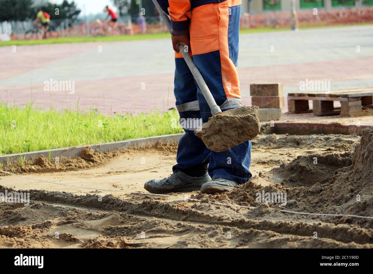 masons sand throw shovels for laying paving slabs in the town square ...